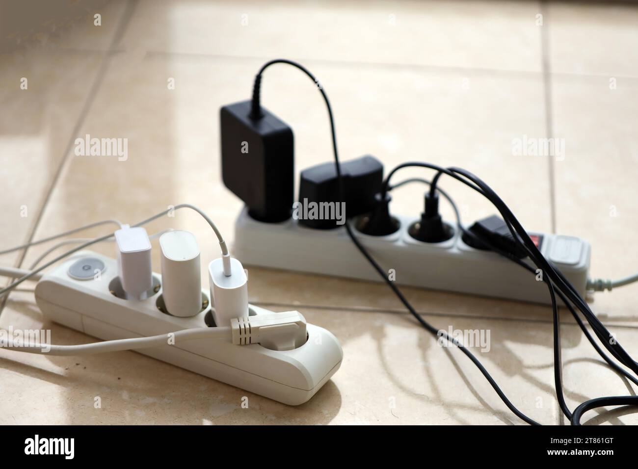 Overloaded power boards. Power strips with different electrical plugs ...