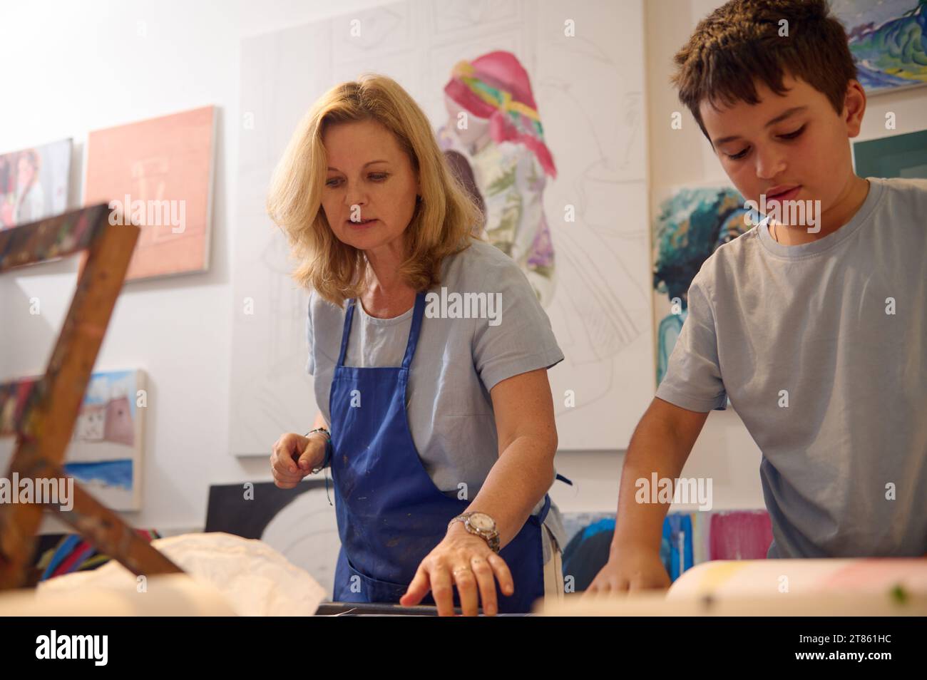 Adorable Caucasian teenage school boy learning painting and art ...