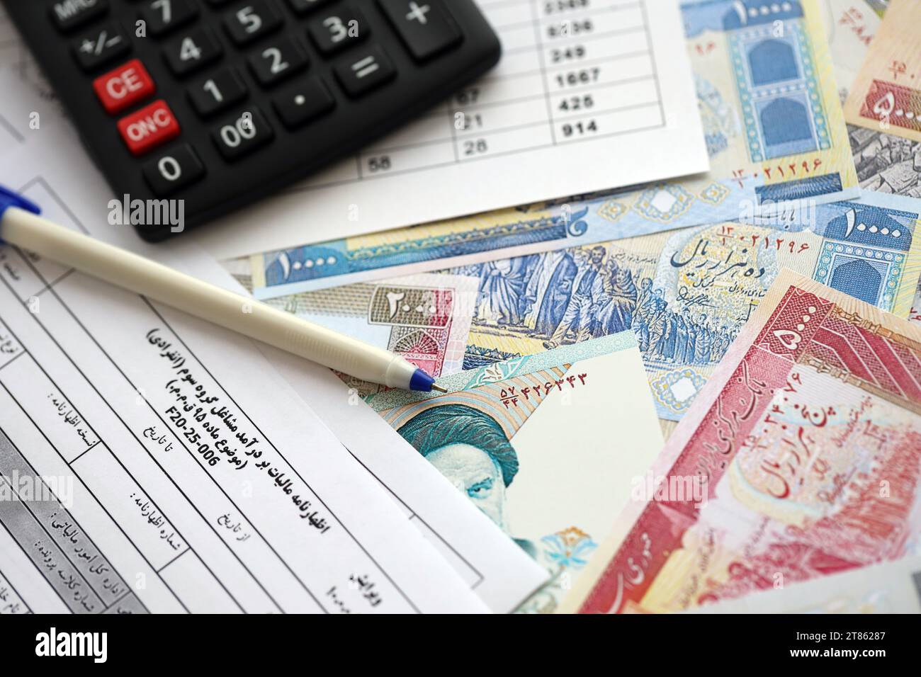 Iranian annual income tax return form F20-25-006 ready to fill on table ...