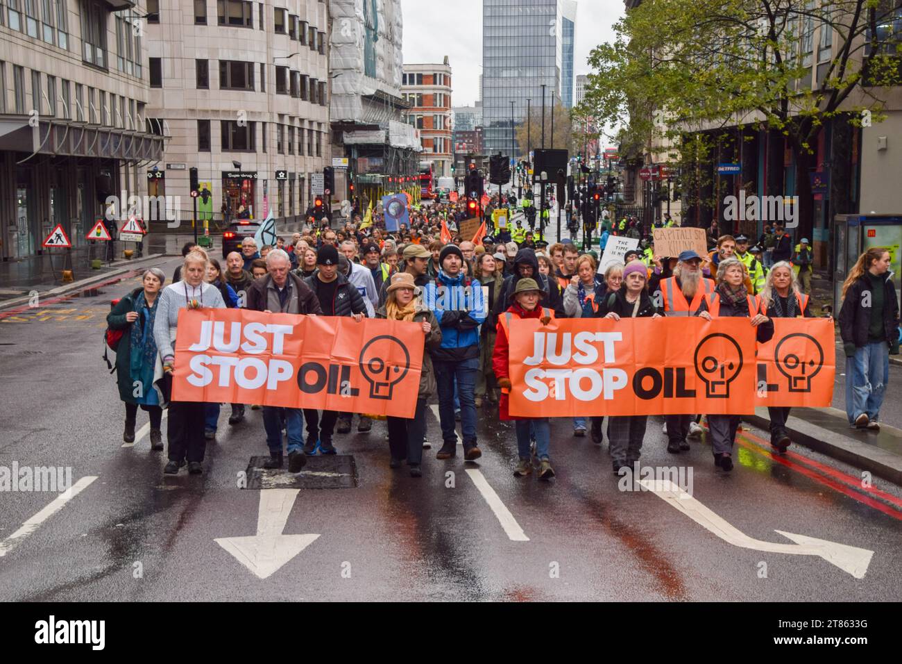 London, UK. 18th November 2023. Just Stop Oil activists march near ...