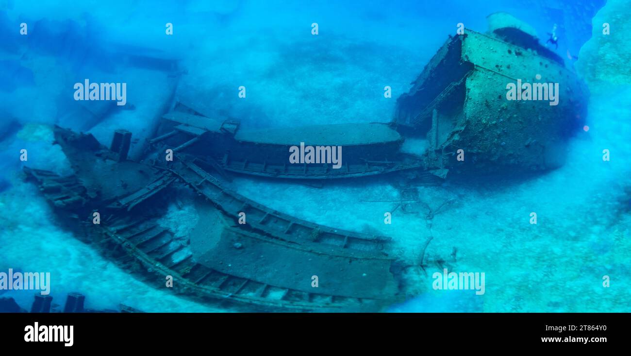 Panoramic view of cargo ships hull shipwrecked and laying in the sands ...