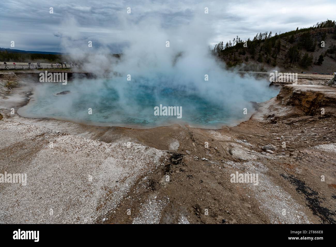 Steam rises from deep blue pool at a geothermal geyser vent in ...