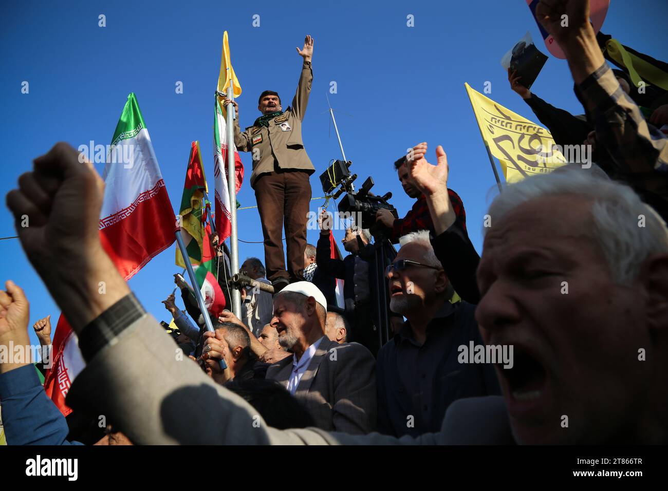 Tehran, Iran. 18th Nov, 2023. Iranian men chant slogans during an anti ...