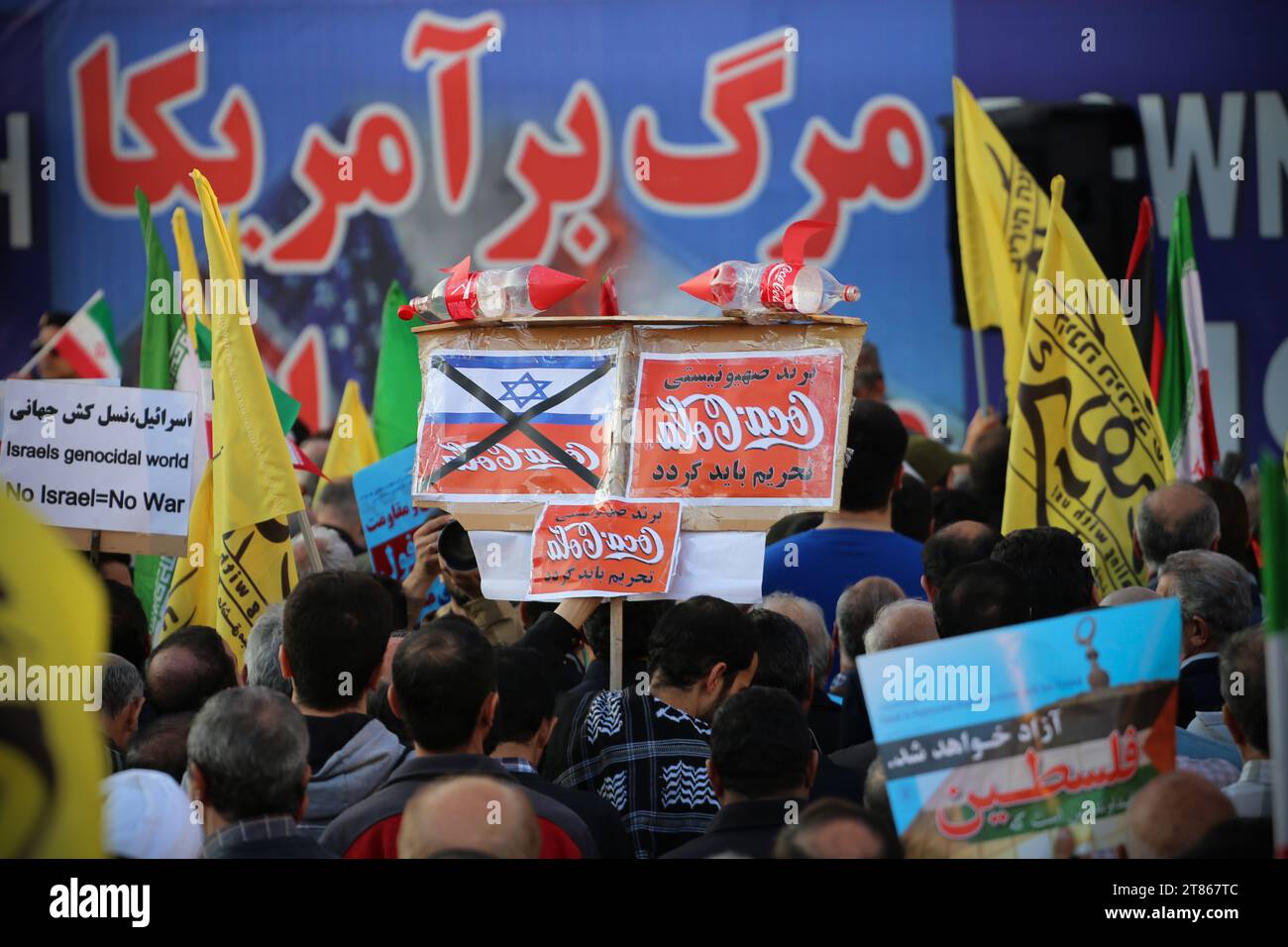 Tehran, Iran. 18th Nov, 2023. An Iranian protester carries a banner ...