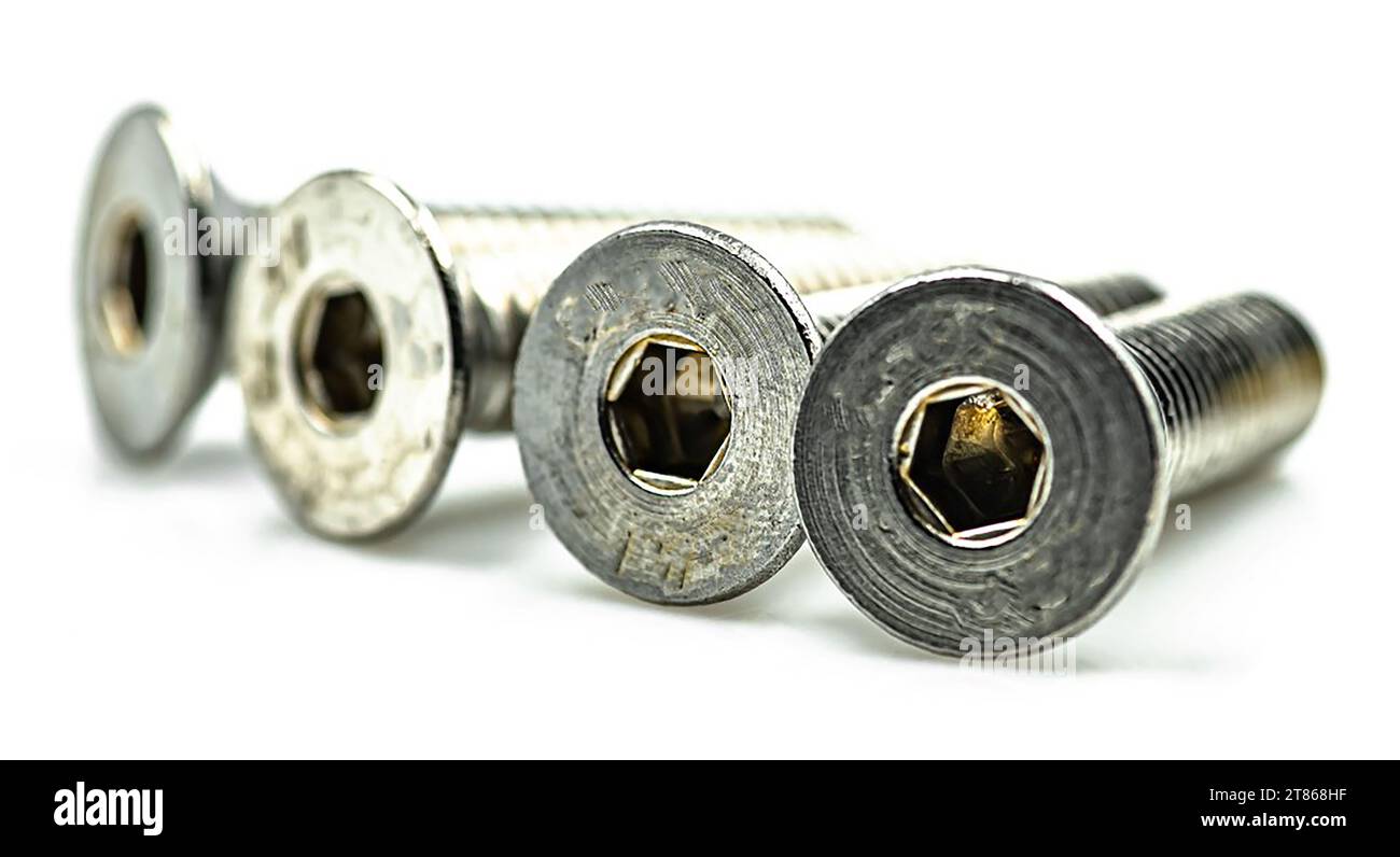 DIN 7991 bolt stainless steel close up white background Stock Photo - Alamy