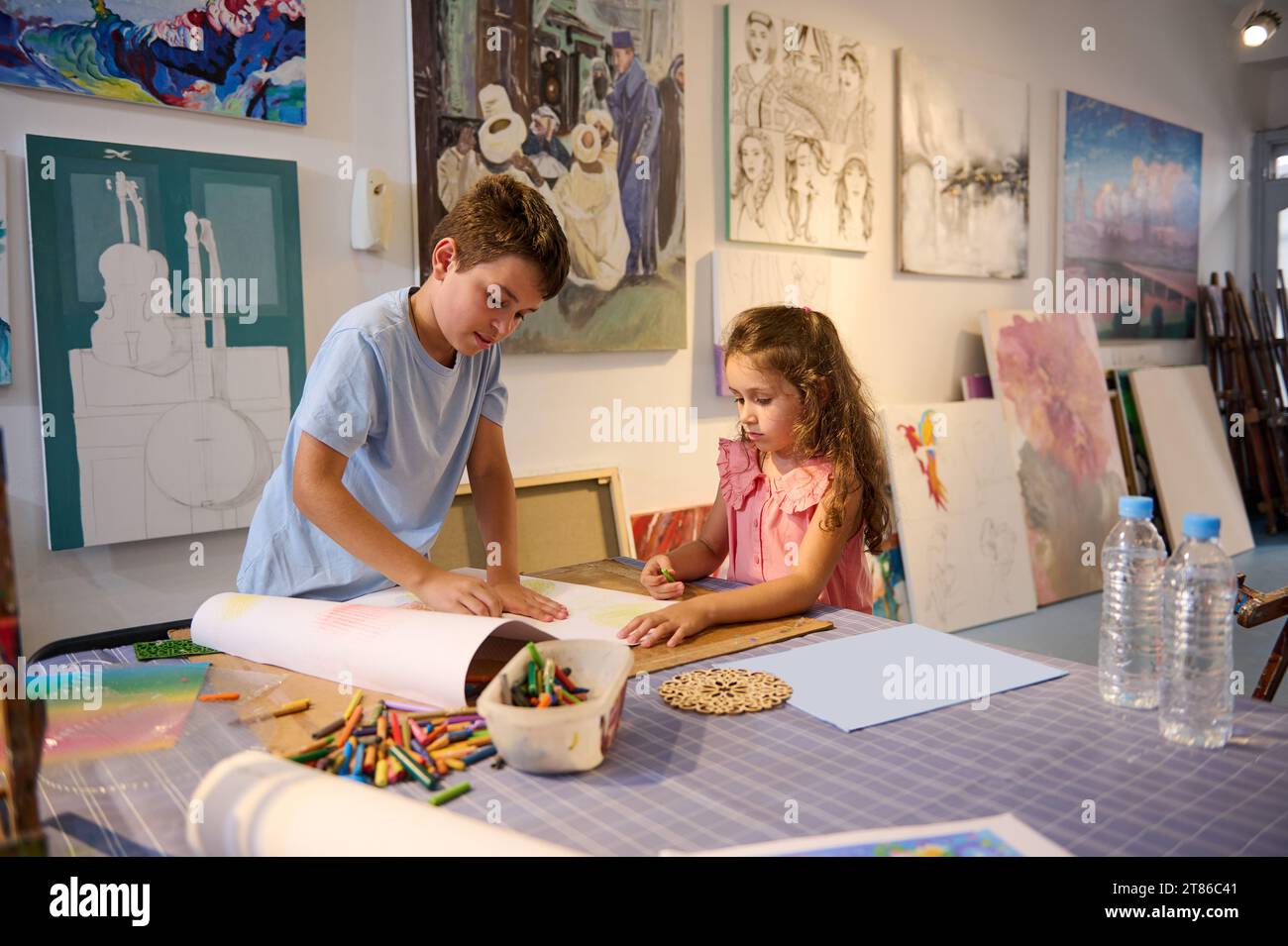 Caucasian adorable inspired learning art, drawing with pencils in ...