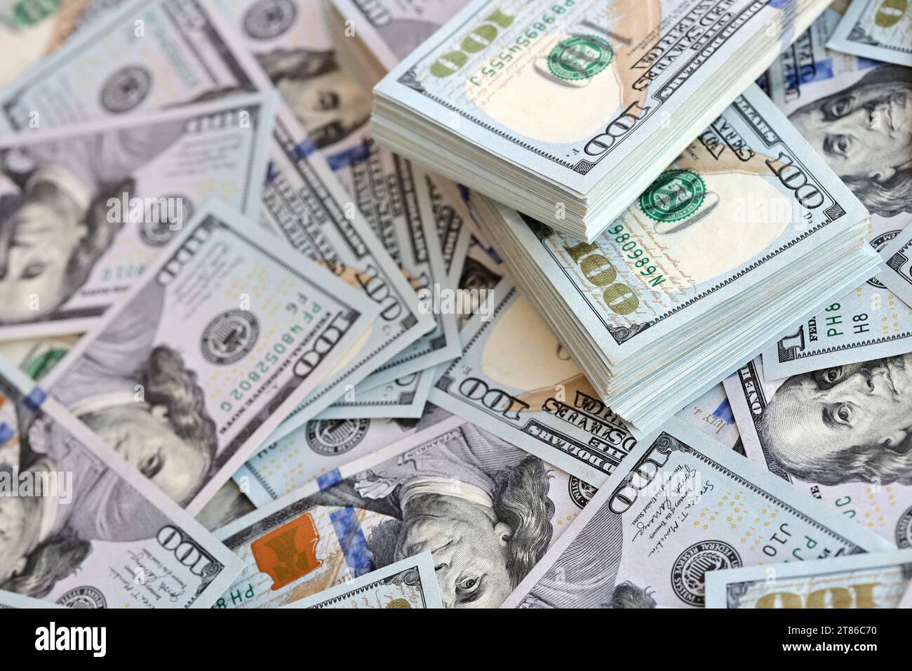 Very big amount of US hundred dollar bills close up. Huge quantity of ...