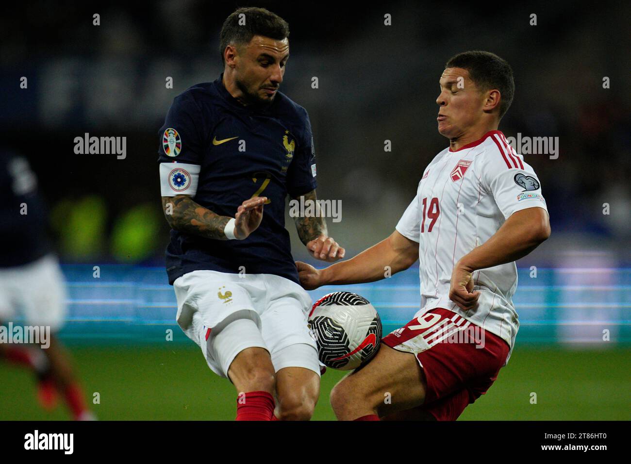 France's Jonathan Clauss, left, and Gibraltar's Tjay De Barr vie for ...