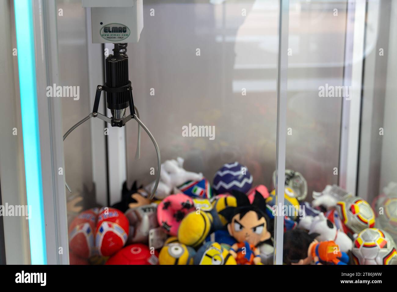 September 19, 2023: A gripper arm slot machine filled with various ...