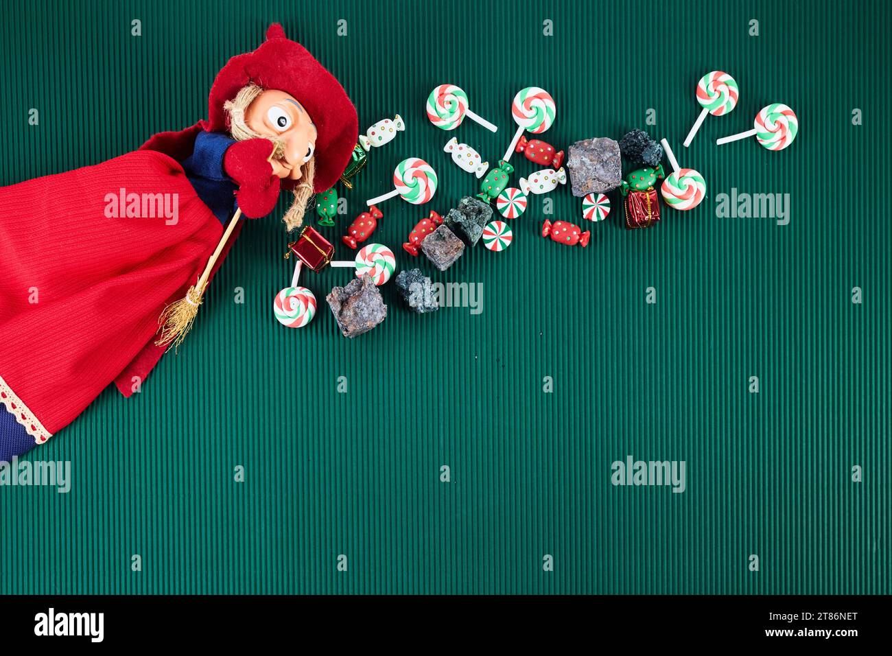 The Befana with sweet coal and candy. Italian Epiphany day tradition ...