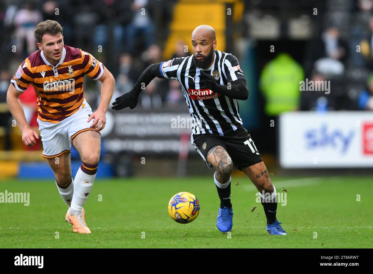 David McGoldrick of Notts County in action under pressure from Matthew Platt of Bradford City ...