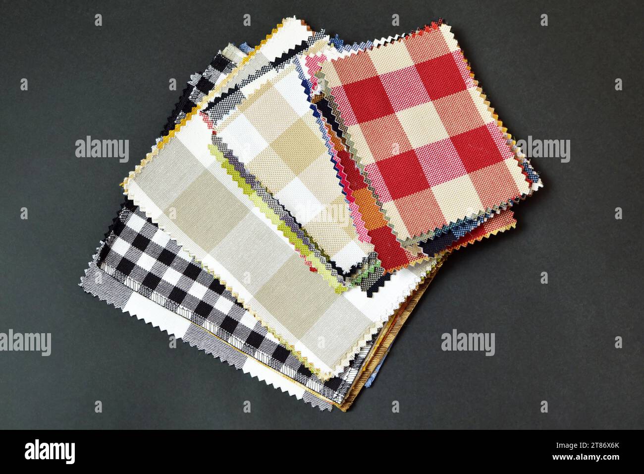 Checkered fabric pattern samples on black background, top view Stock ...