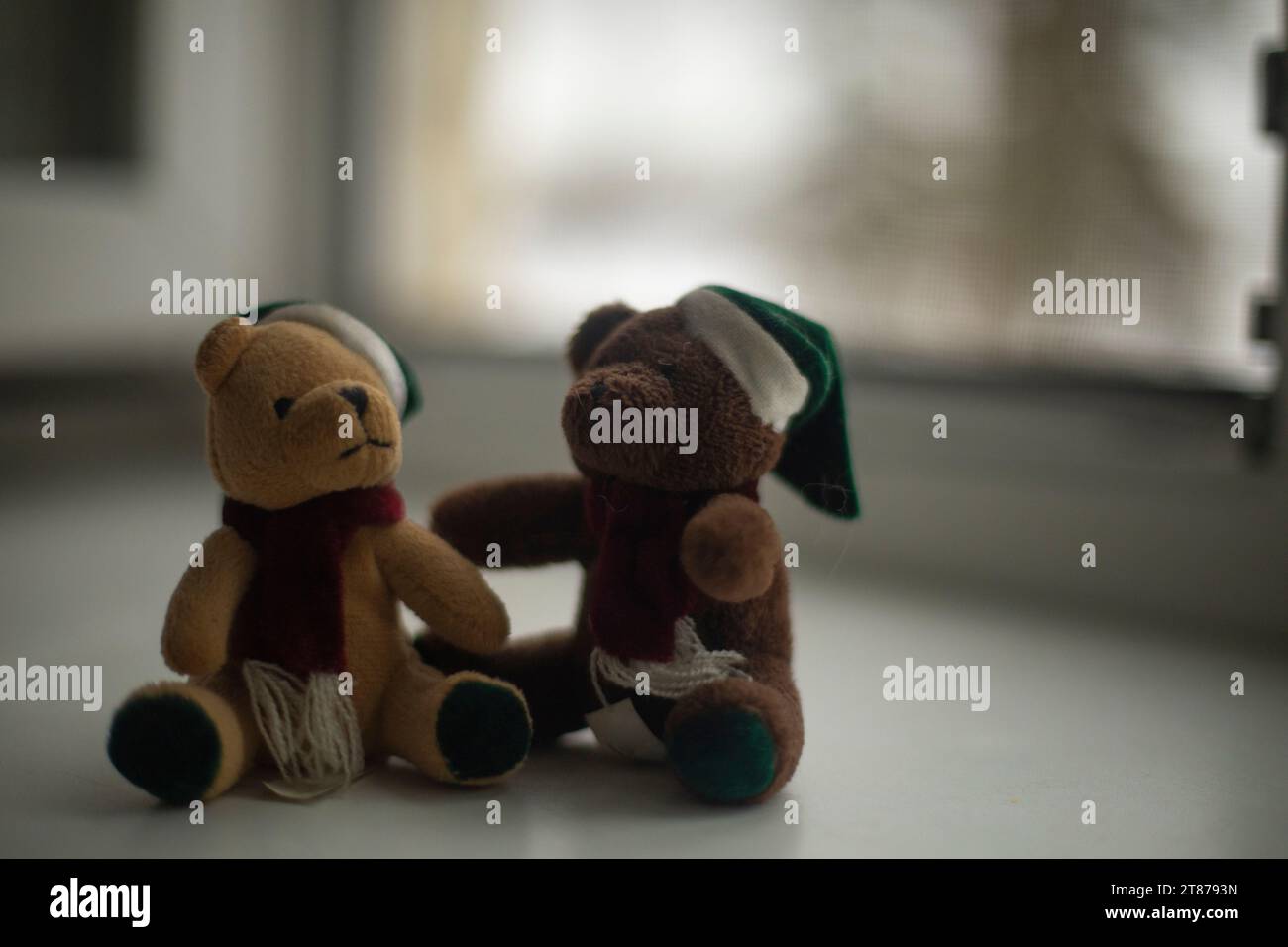 Teddy bears made of fabric. Toys on the window. The items in the ...