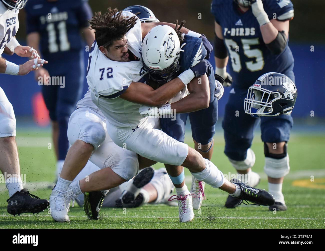 St. Francis Xavier X-Men's Dyton Blackett, left, loses his helmet as he ...