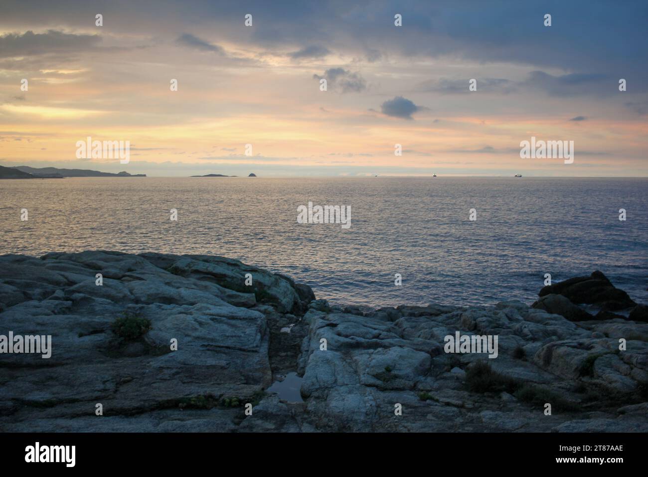 sunset lights in the rocks of the Cantabrian coast in Burela, Spain ...