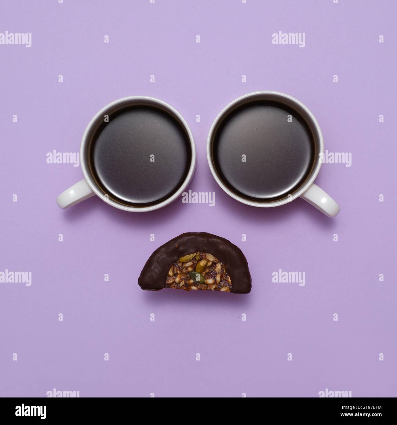 Coffee creative sad face. Smile from two cups of black espresso and ...