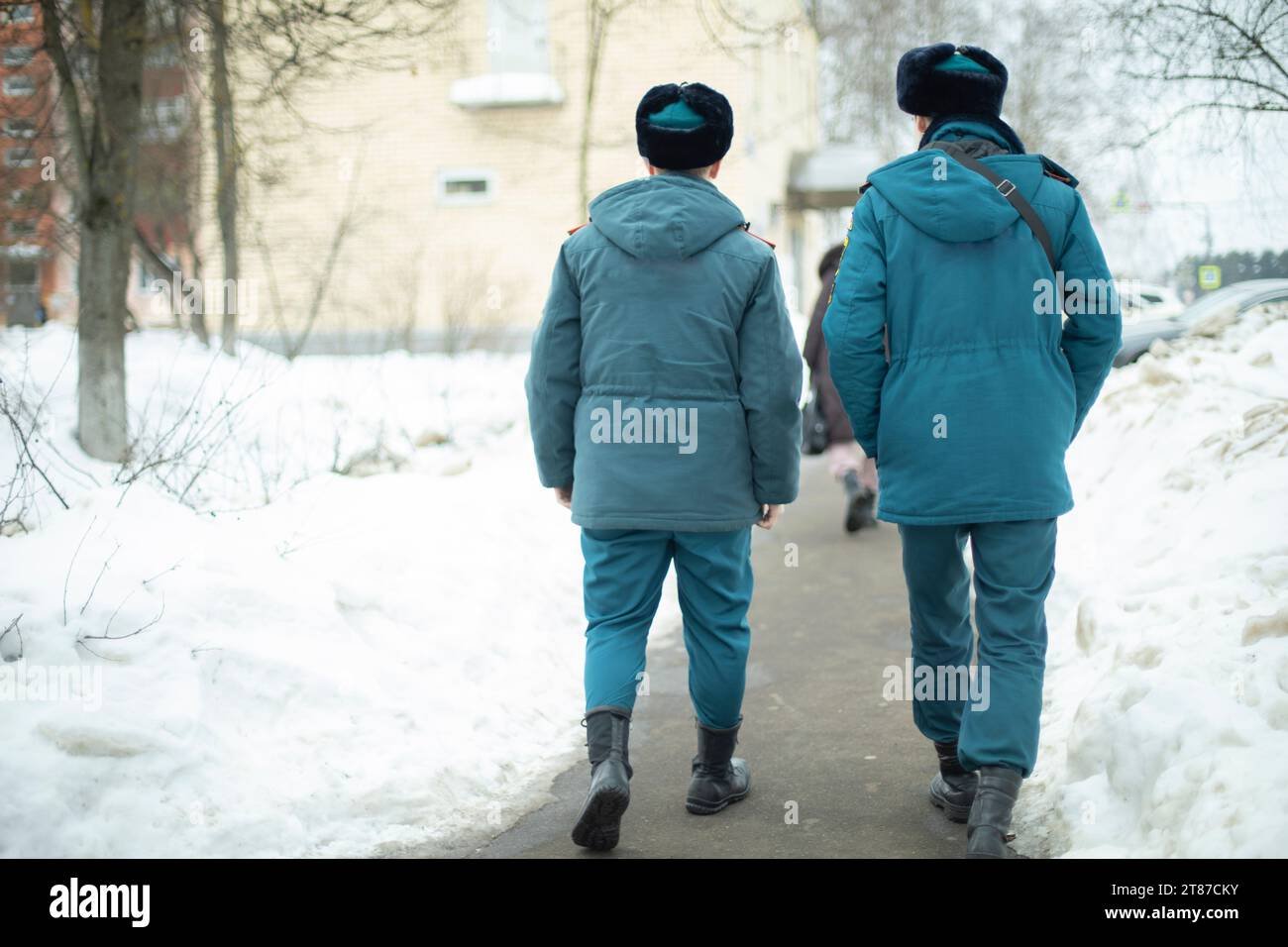 Two guys in uniform. Men come from service in Russia. People in warm ...