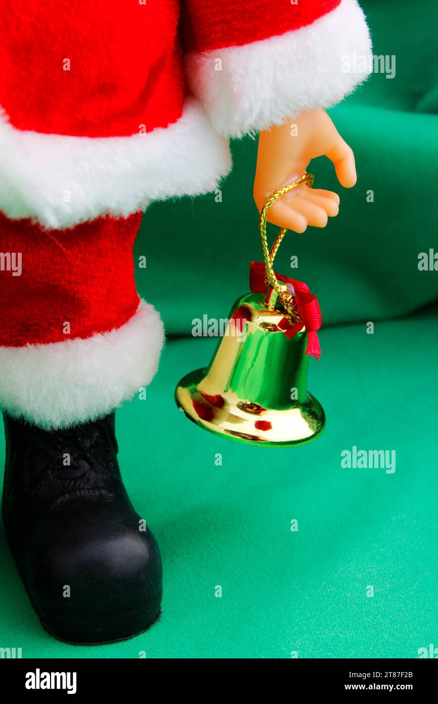 Santa Claus with golden bell Stock Photo - Alamy