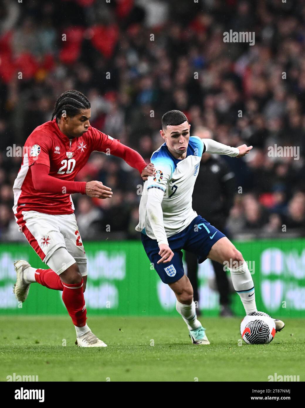 LONDON, ENGLAND - November 17: Yannick Yankam of Malta, Phil Foden of ...