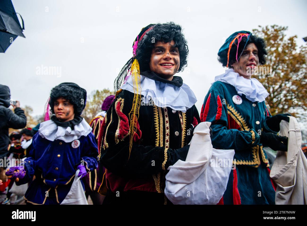 A group of St. Nicholas' helpers seen arriving at the city. The first ...