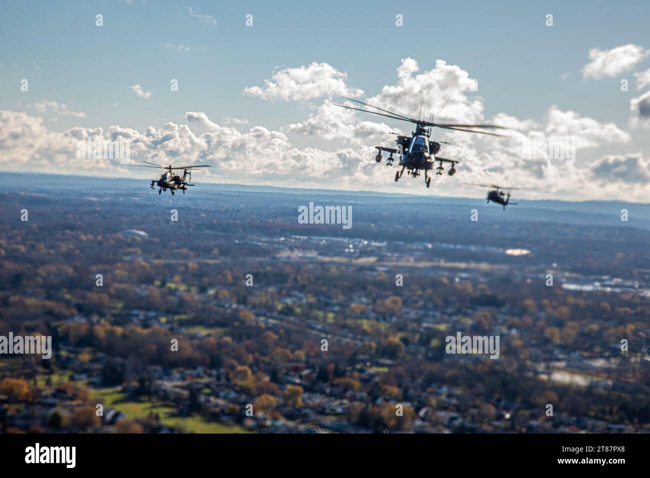A formation of aircraft composed of two Boeing AH-64 Apache and one ...