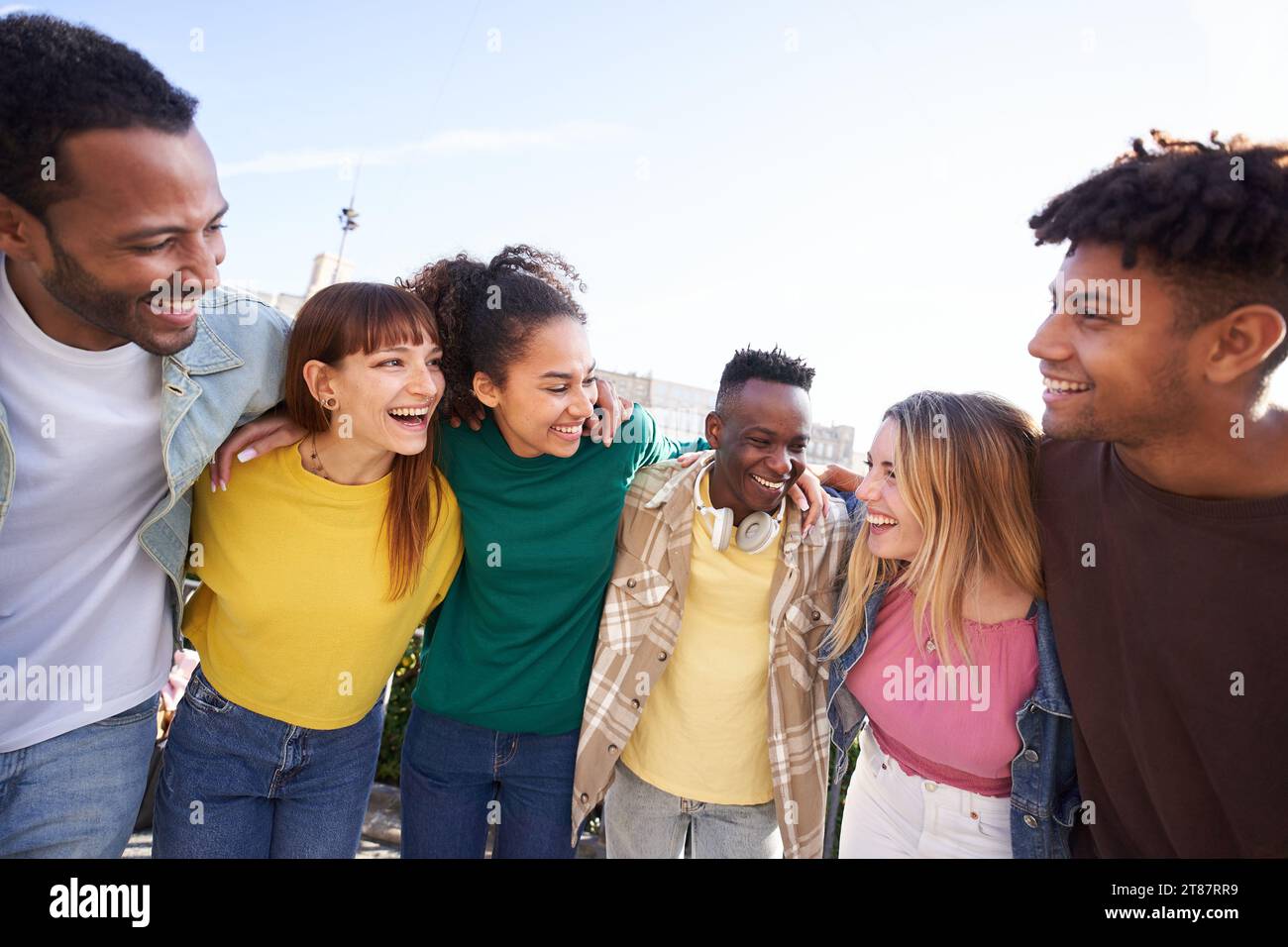 Multiracial young people team hugging together outdoor, diverse ...