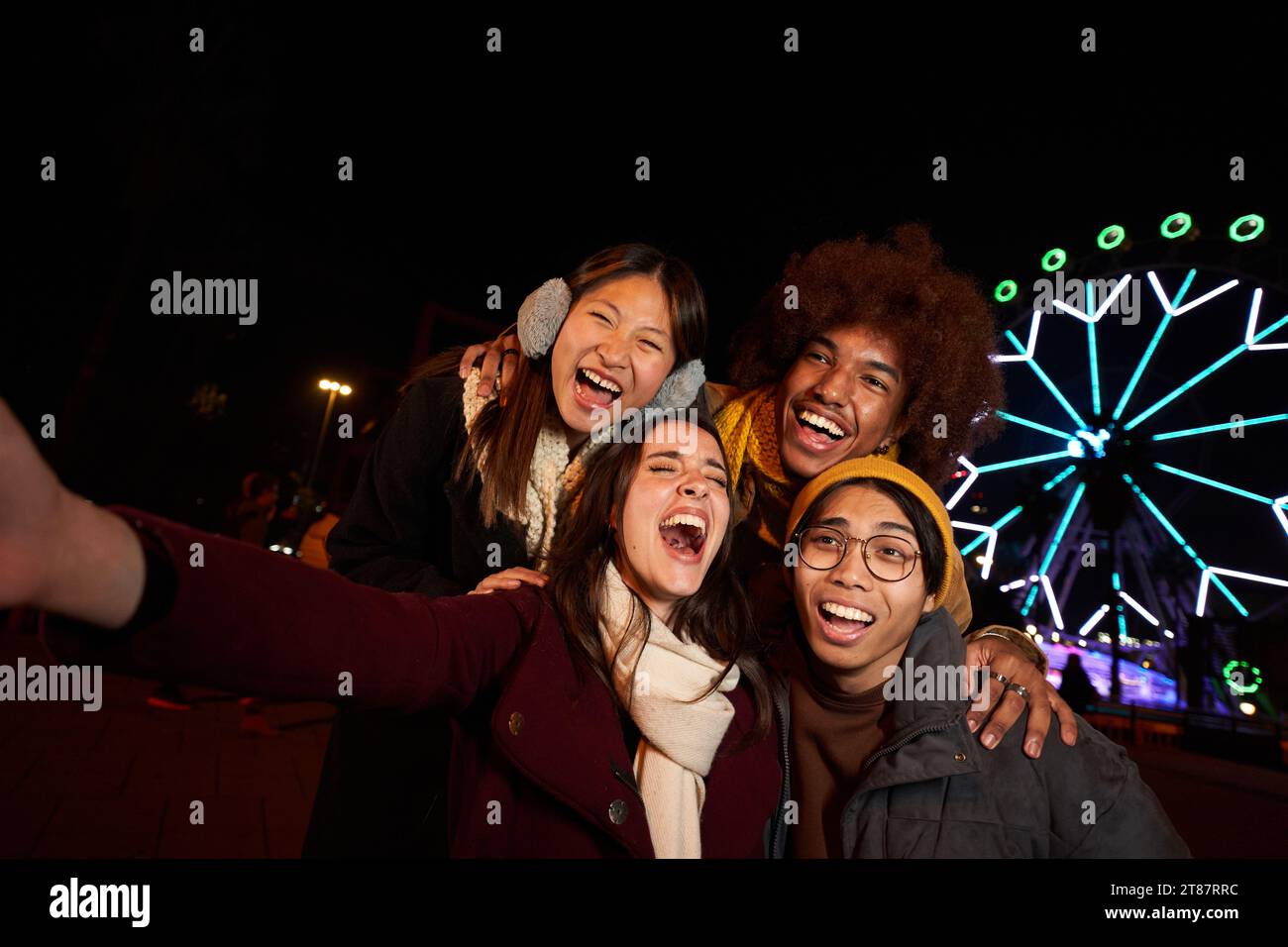 Selfie phone multiracial group of happy colleagues having fun in winter ...