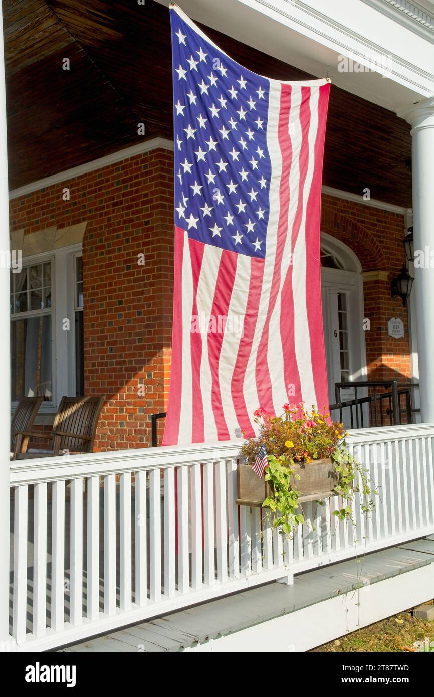 Horizontal displayed American flag on historic 1829 Curtis hotel in ...