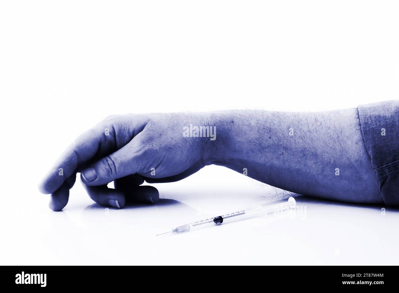 Addiction syringe and blue arm Stock Photo - Alamy