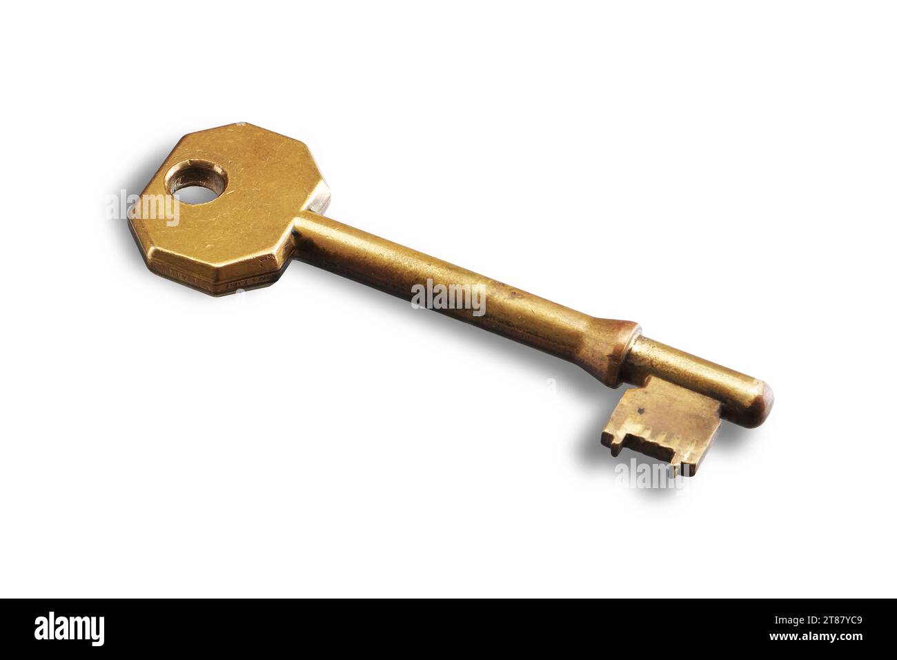 An old brass key with shadow Stock Photo - Alamy