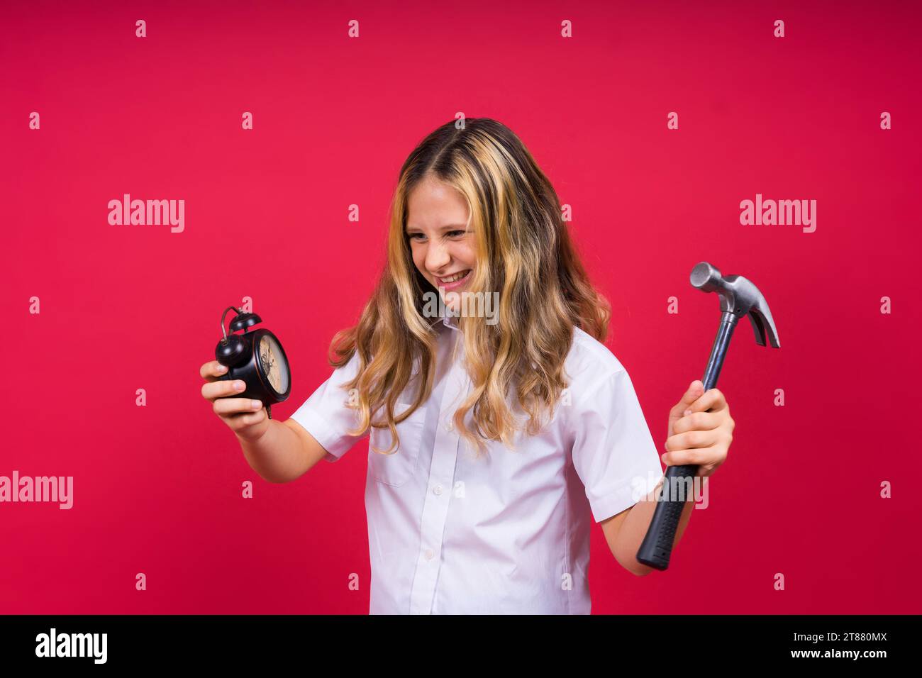 Kid girl holding hammer and alarm clock smiling with a happy and cool ...