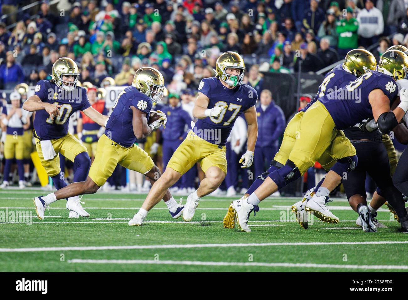 South Bend, Indiana, USA. 18th Nov, 2023. Notre Dame running back Audric Estimé (7) runs with ...