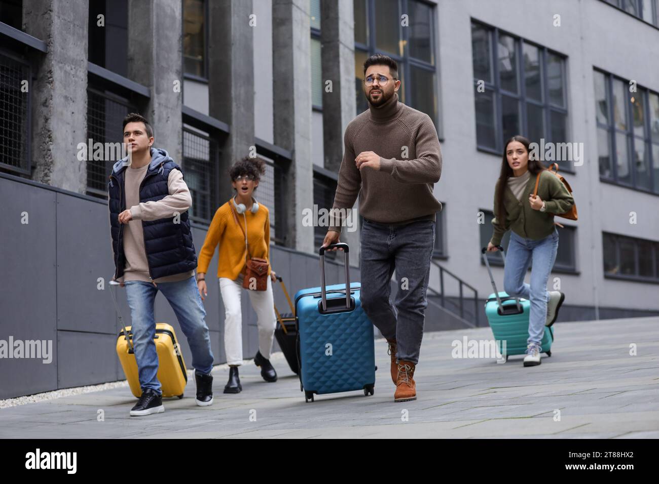 Being late. Group of people with suitcases running outdoors Stock Photo ...