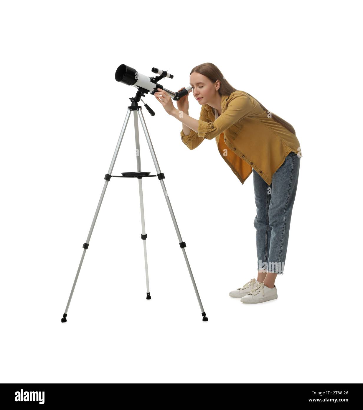Young astronomer looking at stars through telescope on white background ...