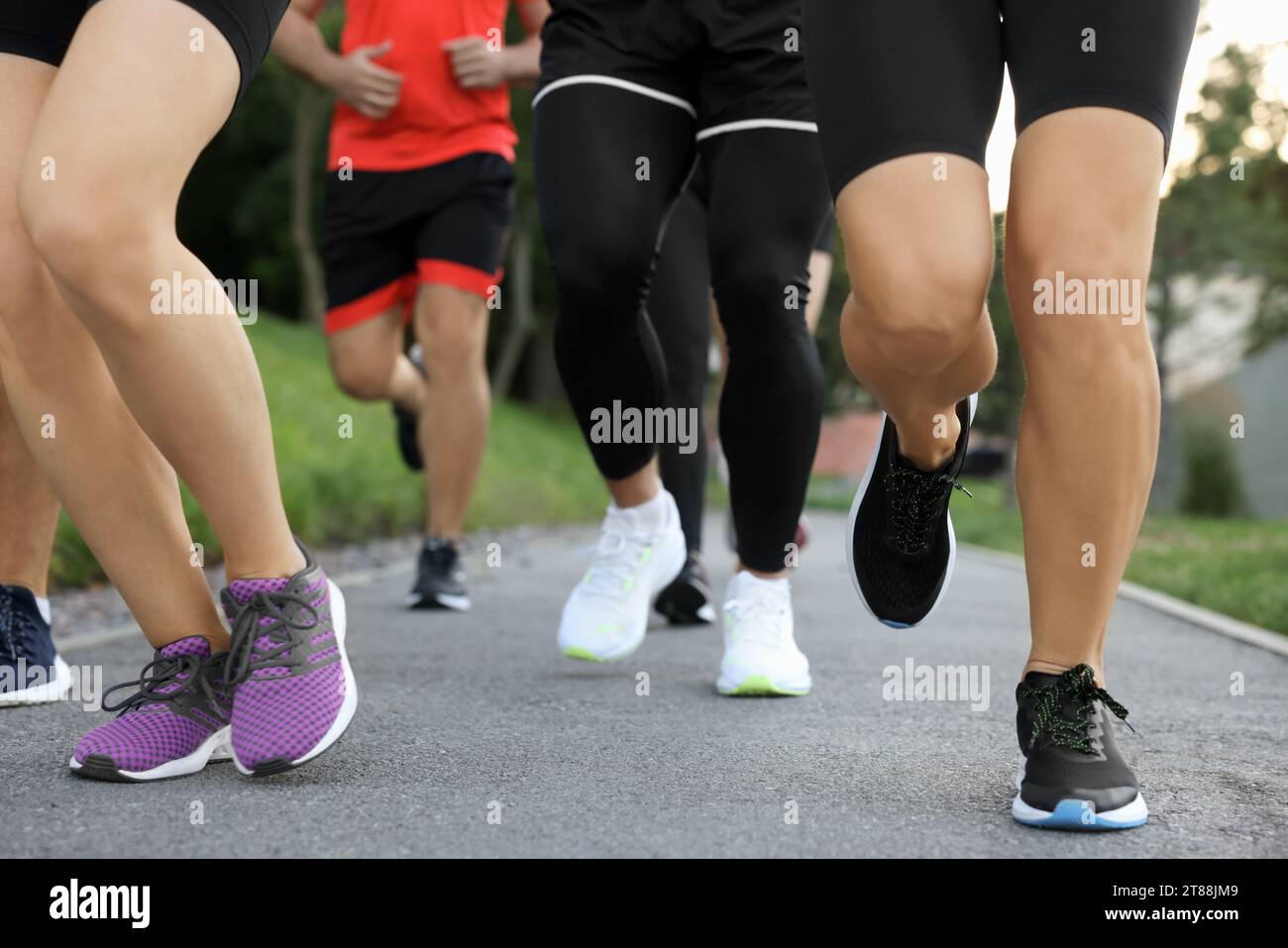 Group of people running outdoors, closeup view Stock Photo - Alamy