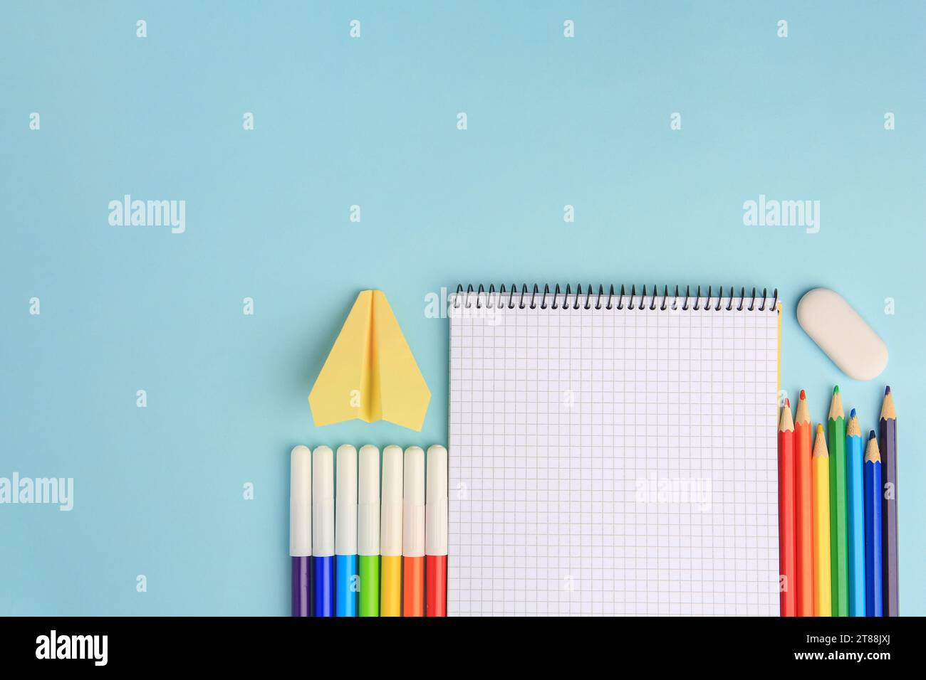 Flat lay composition with open notebook and other school stationery on ...