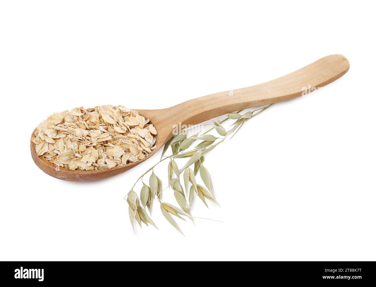 Wooden spoon of oatmeal and branch with florets isolated on white Stock ...