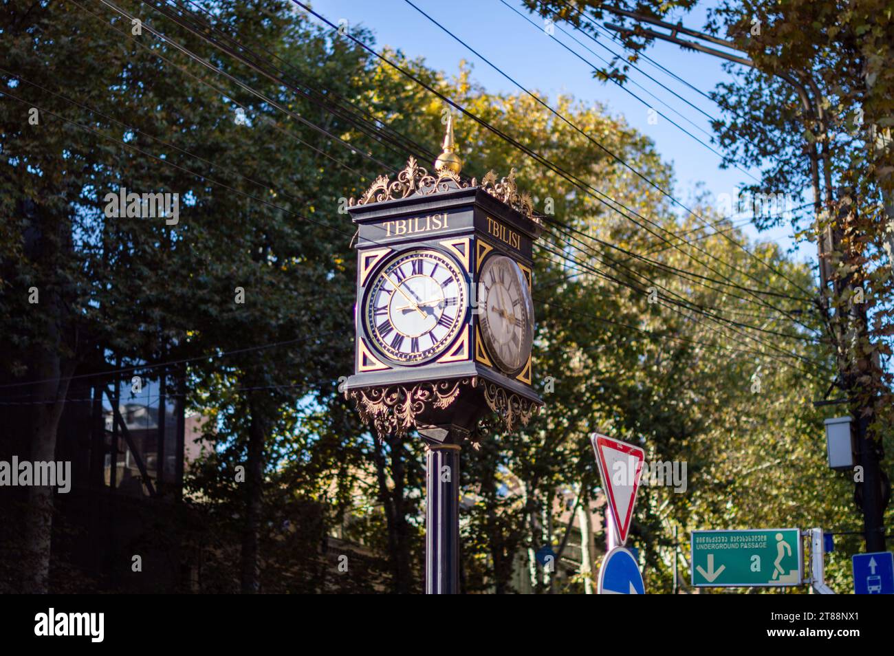 Wide shot of classic style street clock in Tbilisi city, Georgia Stock ...