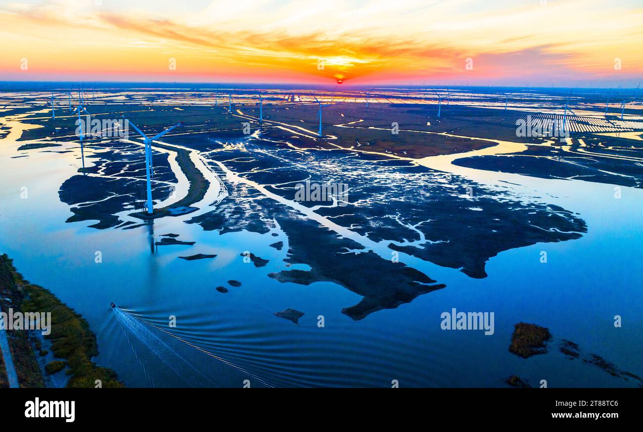 YANCHENG, CHINA - NOVEMBER 18, 2023 - Wind turbine blades rotate in the ...