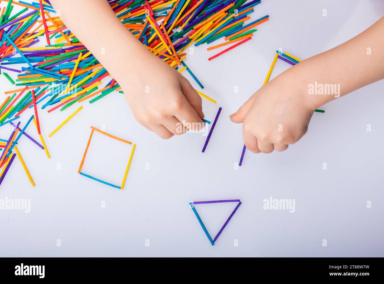 Kid making rectangular and triangle shape as creative concept Stock ...