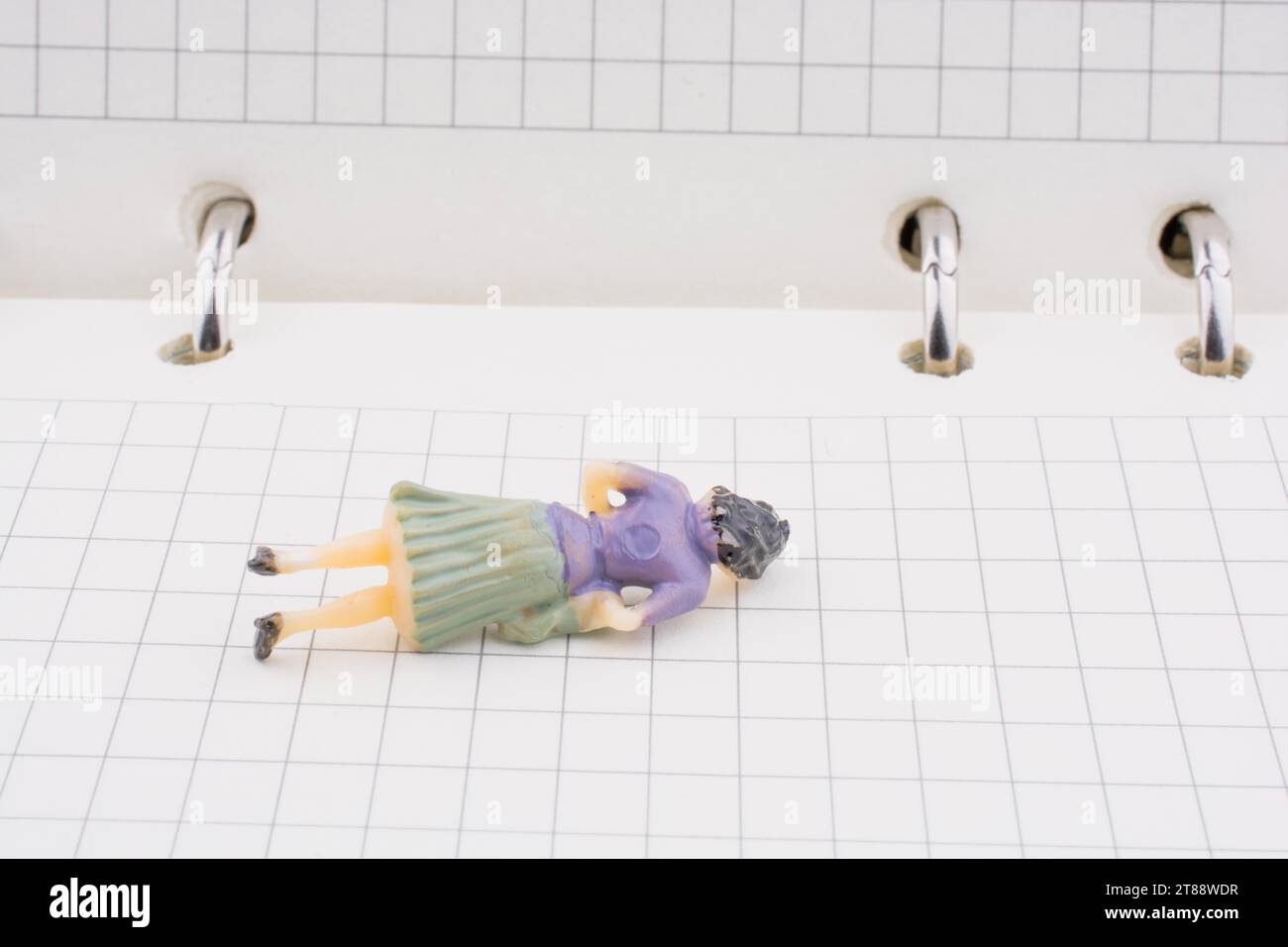 Human figure on a white spiral notebook Stock Photo - Alamy