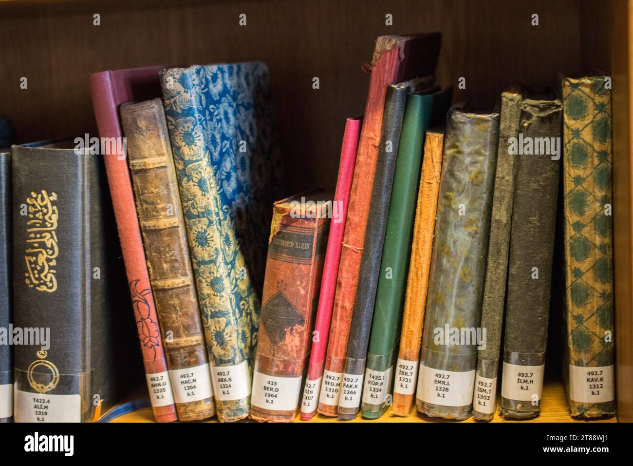 Bookshelf with old Turkish Ottoman handwriting books Stock Photo - Alamy