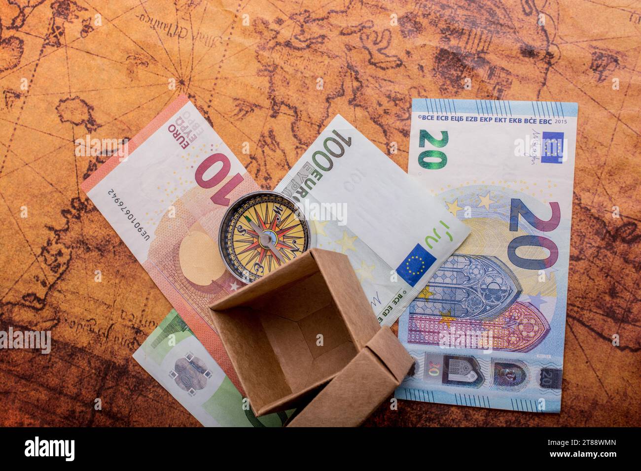 Compass, box and Euro banknotes on map as business concept Stock Photo ...