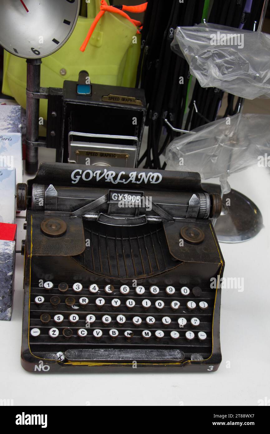 Retro syled tiny typewriter model on a white background Stock Photo - Alamy