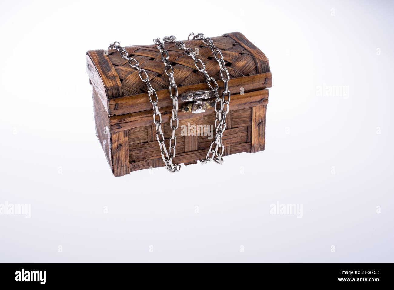 Wooden brown treasure box in chains on a white background Stock Photo ...