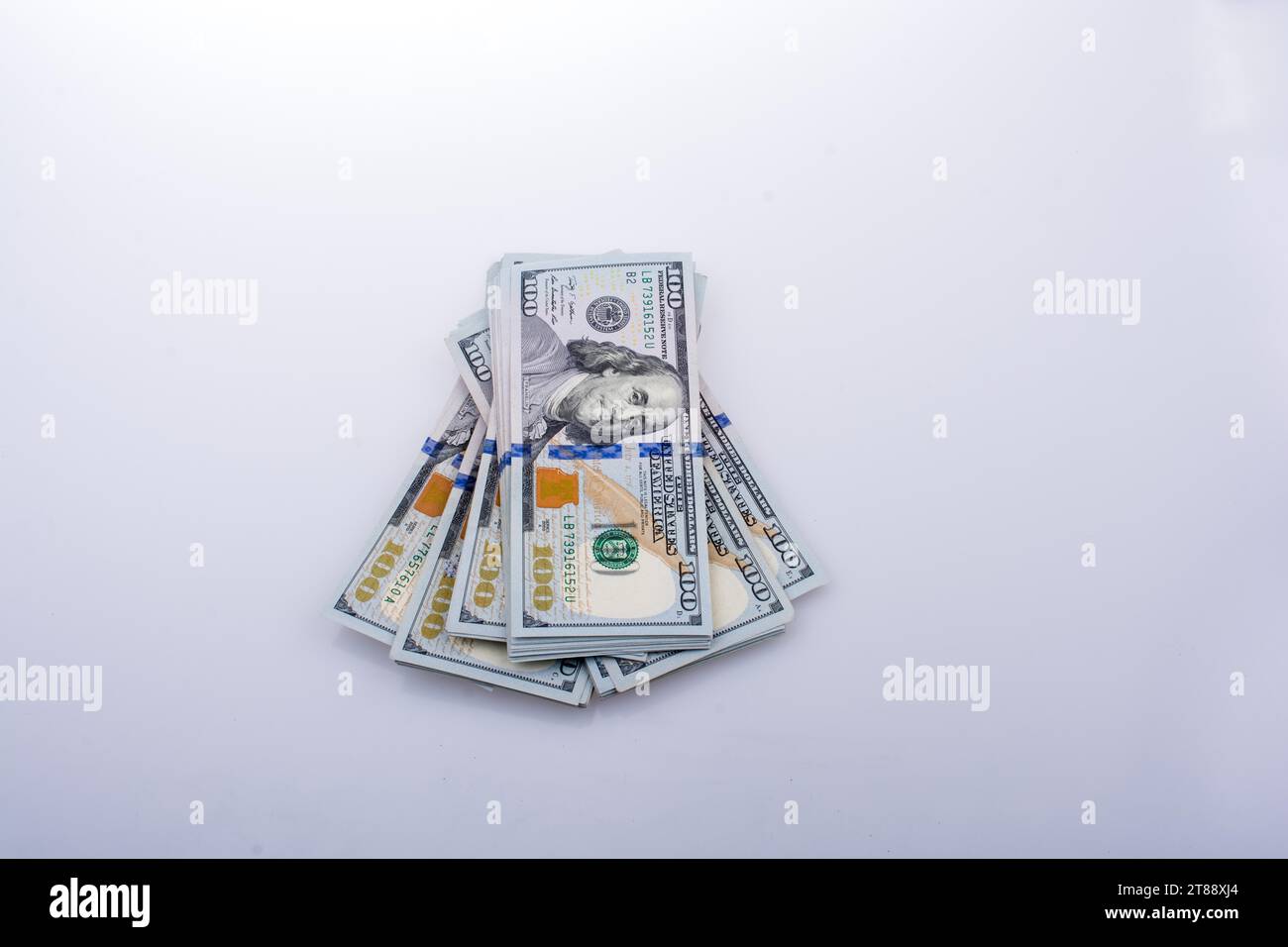 American 100 dollar banknote bundles placed on white background Stock ...