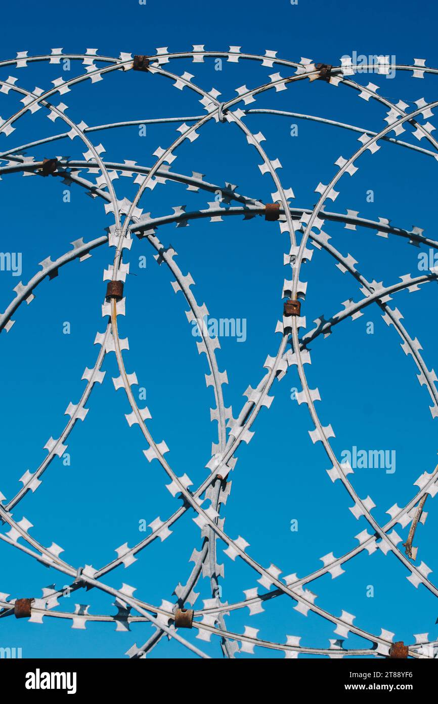 Barbed wire fence used for protection purposes Stock Photo - Alamy