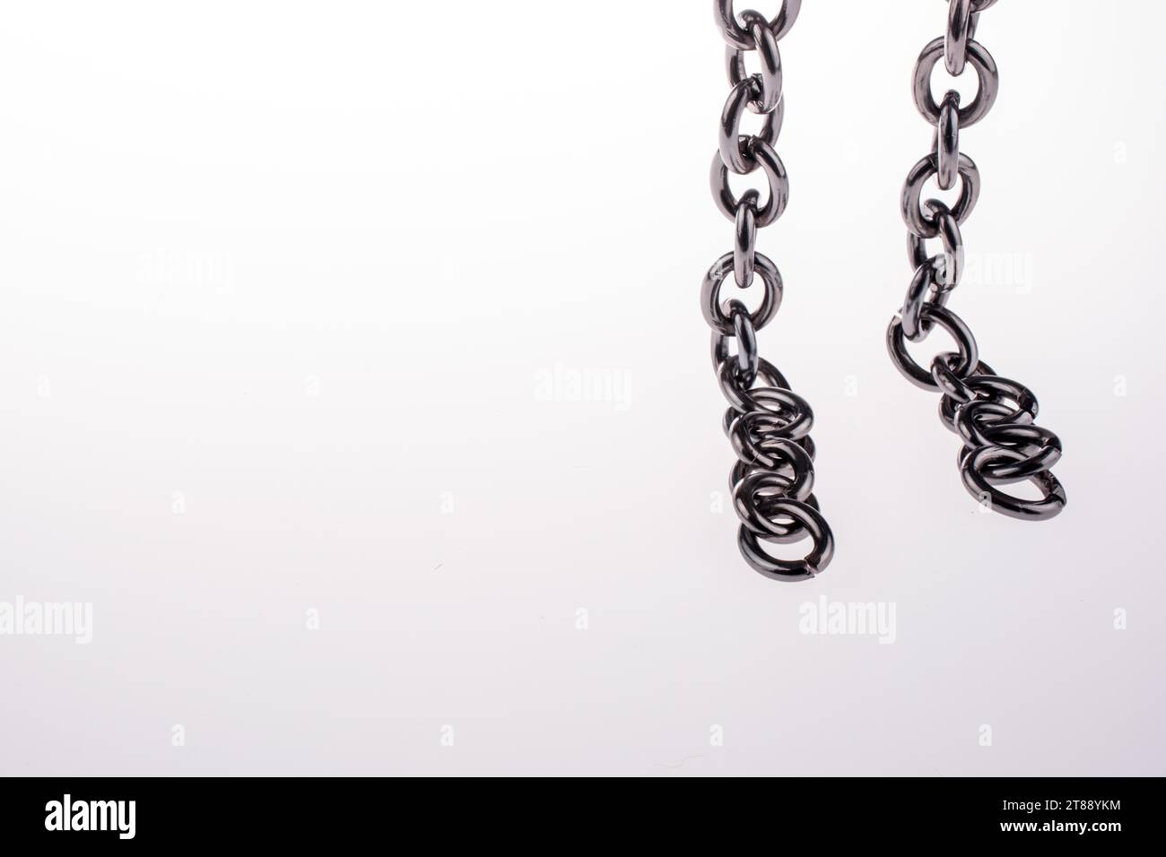 Metal chain on white background Stock Photo - Alamy