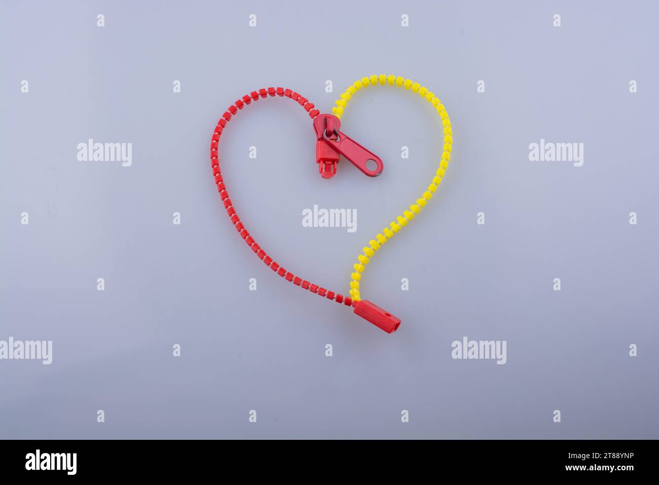 Heart shaped made by the help of a zipper on white background Stock ...