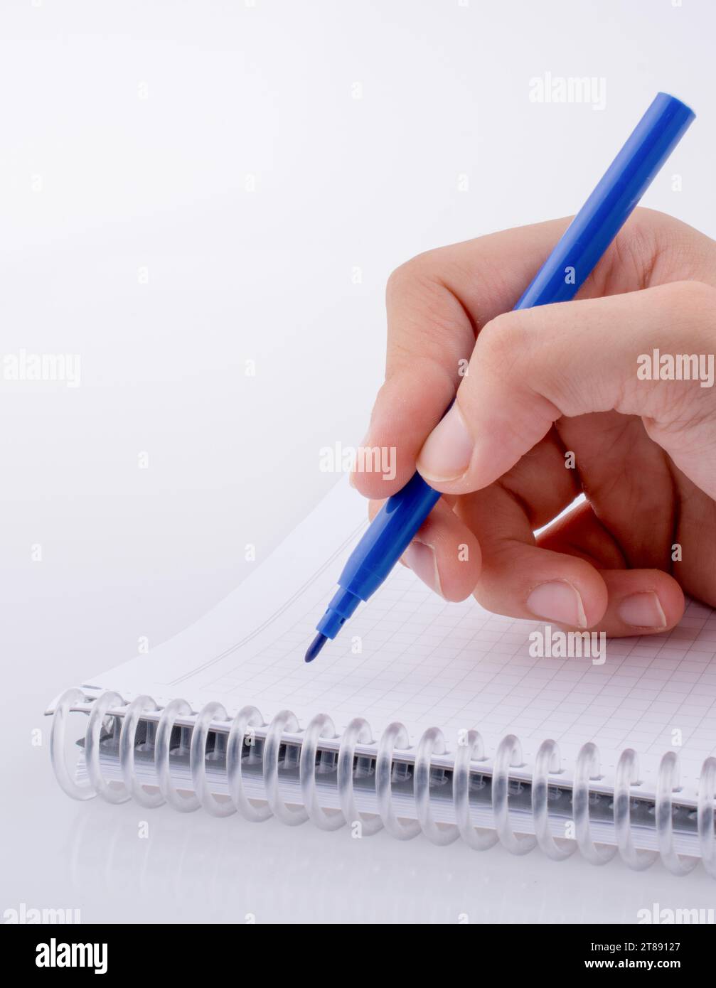 Hand writing on a Notebook with a pen on a white background Stock Photo ...